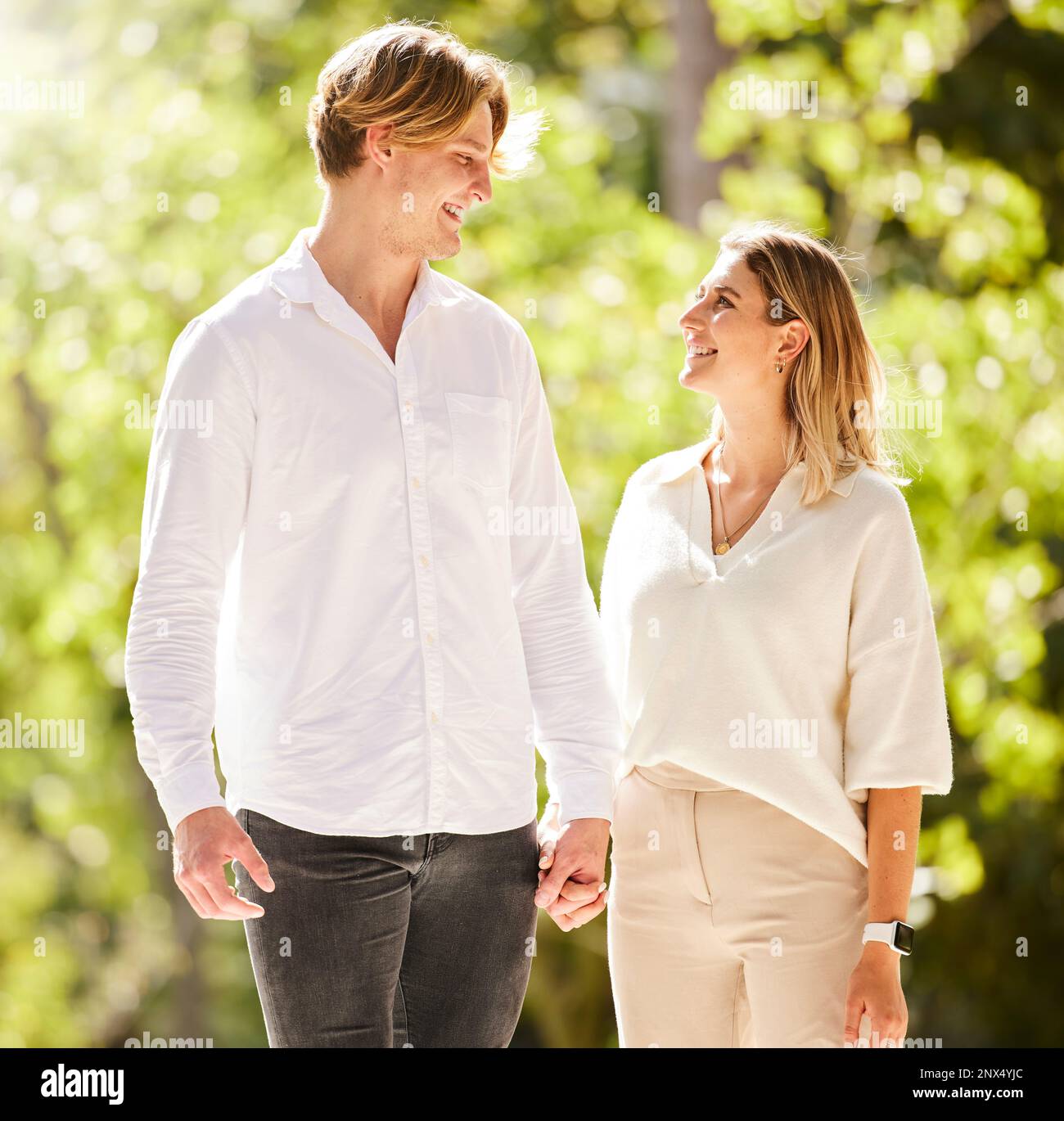 Couple, walking and smile in park, garden and nature for partner love ...