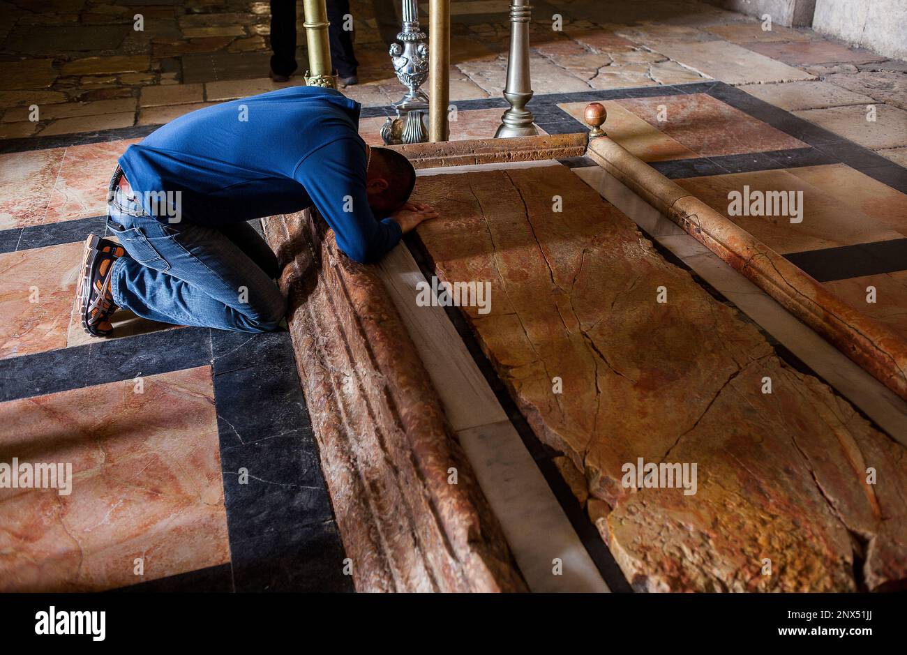 Man praying,Stone of Unction, Church of the Holy Sepulchre also called ...