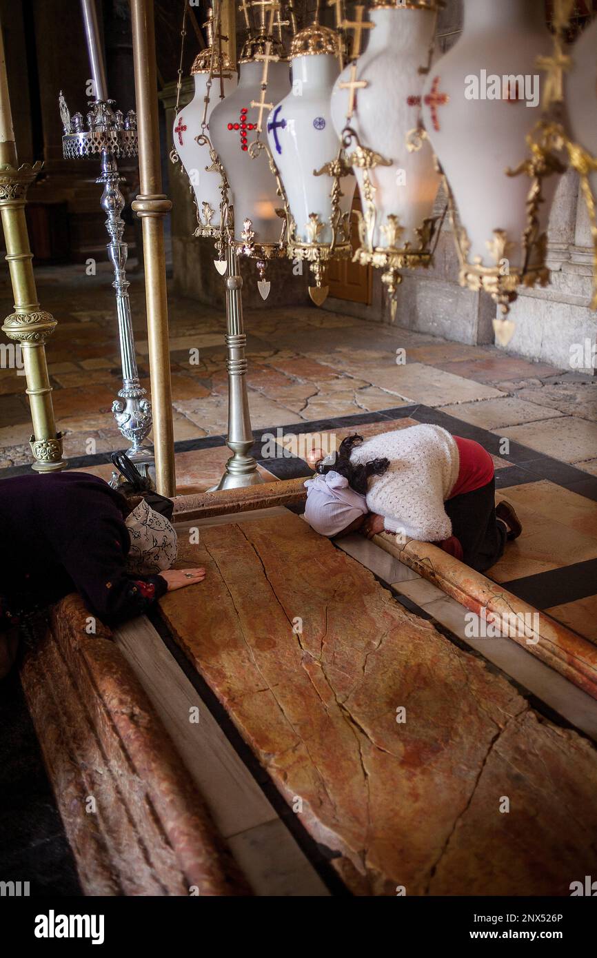 Women praying,Stone of Unction, Church of the Holy Sepulchre also ...