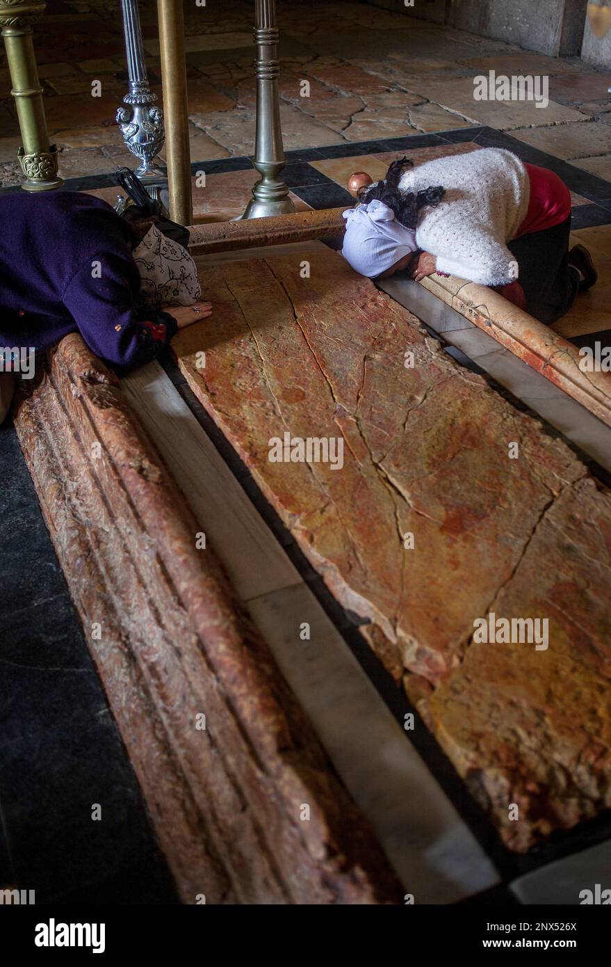 Women praying,Stone of Unction, Church of the Holy Sepulchre also ...