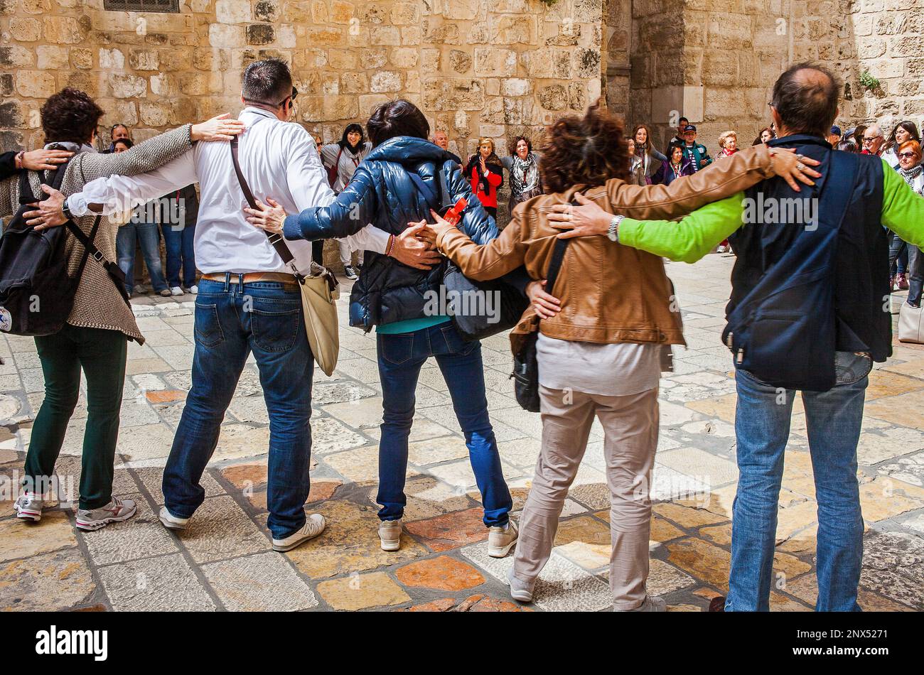 Pilgrims following Jesus' steps on the Via Dolorosa, in exterior of ...