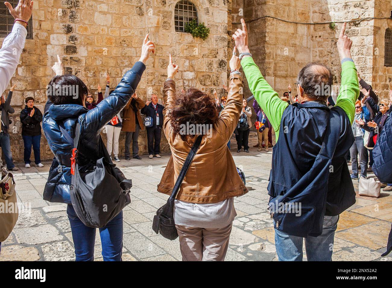 Pilgrims following Jesus' steps on the Via Dolorosa, in exterior of ...