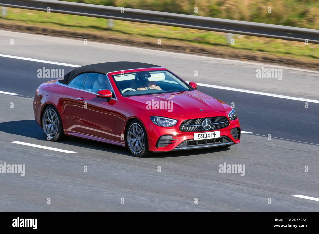 2021 Red MERCEDES BENZ E 220 AMG LINE PREMIUM; travelling on the M6 ...