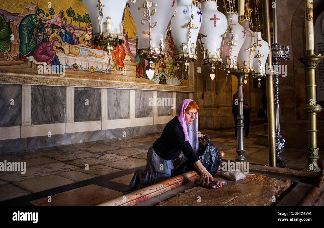 Women praying,Stone of Unction, Church of the Holy Sepulchre also ...