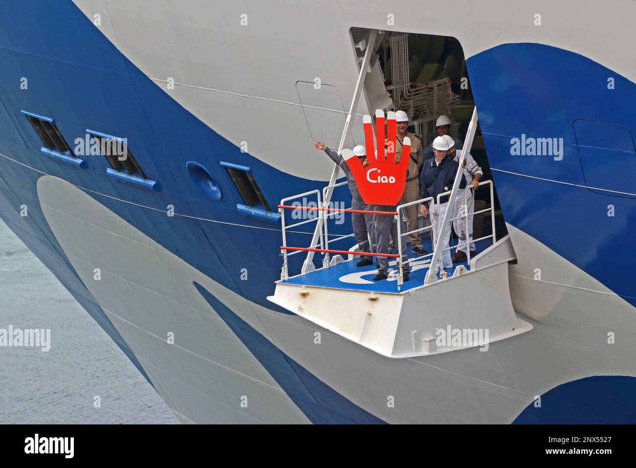 Cruise ship crew waving Ciao sign as it departs St George's, Grenada ...