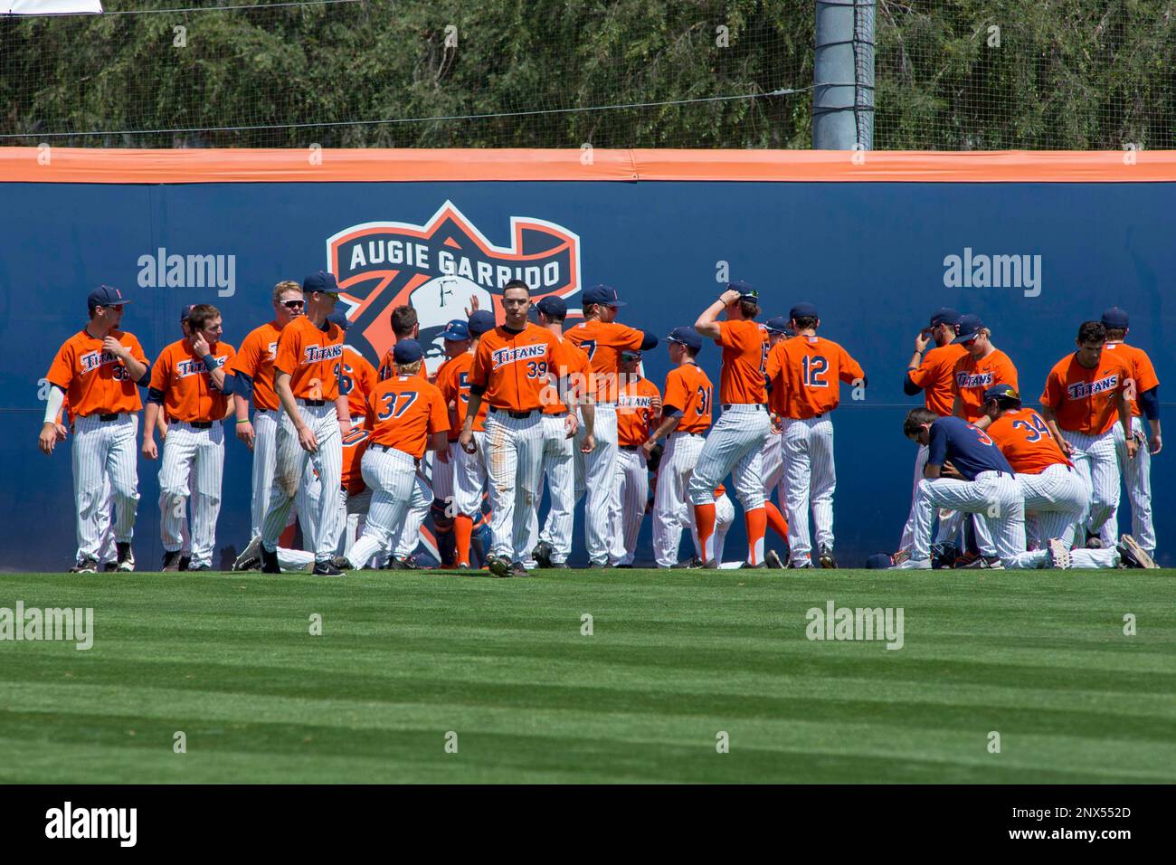 Cal State Fullerton Titan players meet in the outfield prior to the ...