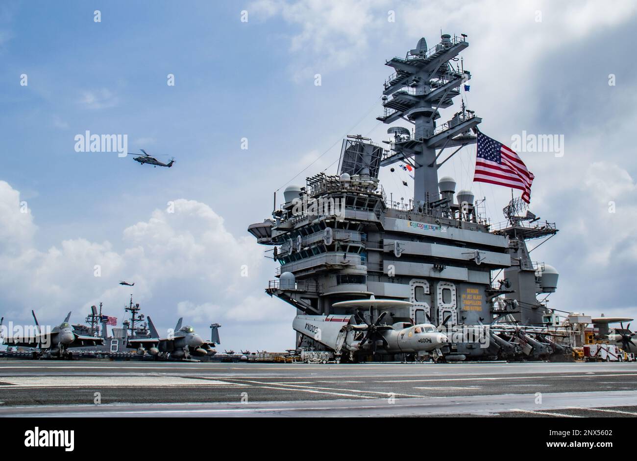 230215-N-MJ302-1248 SOUTH CHINA SEA (Feb. 15, 2023) Ships and aircraft ...