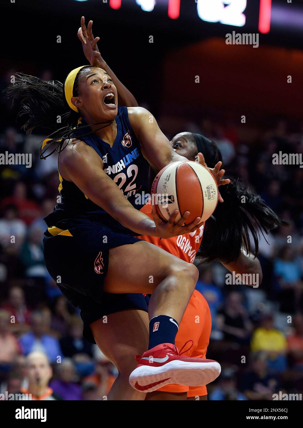 Indiana Fever forward Erica McCall (22) drives around the defense of ...