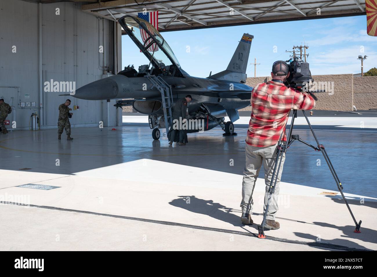 Fox News videographer, Bryan Allman, films correspondent, Matt Finn, as ...