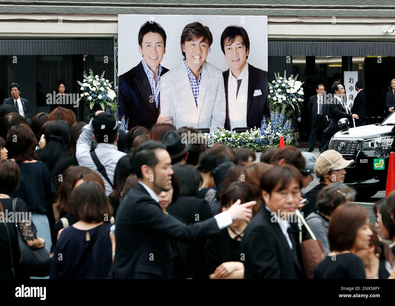 A portrait of Hideki Saijo, a Japanese popular singer, is displayed, center, with other stars ...
