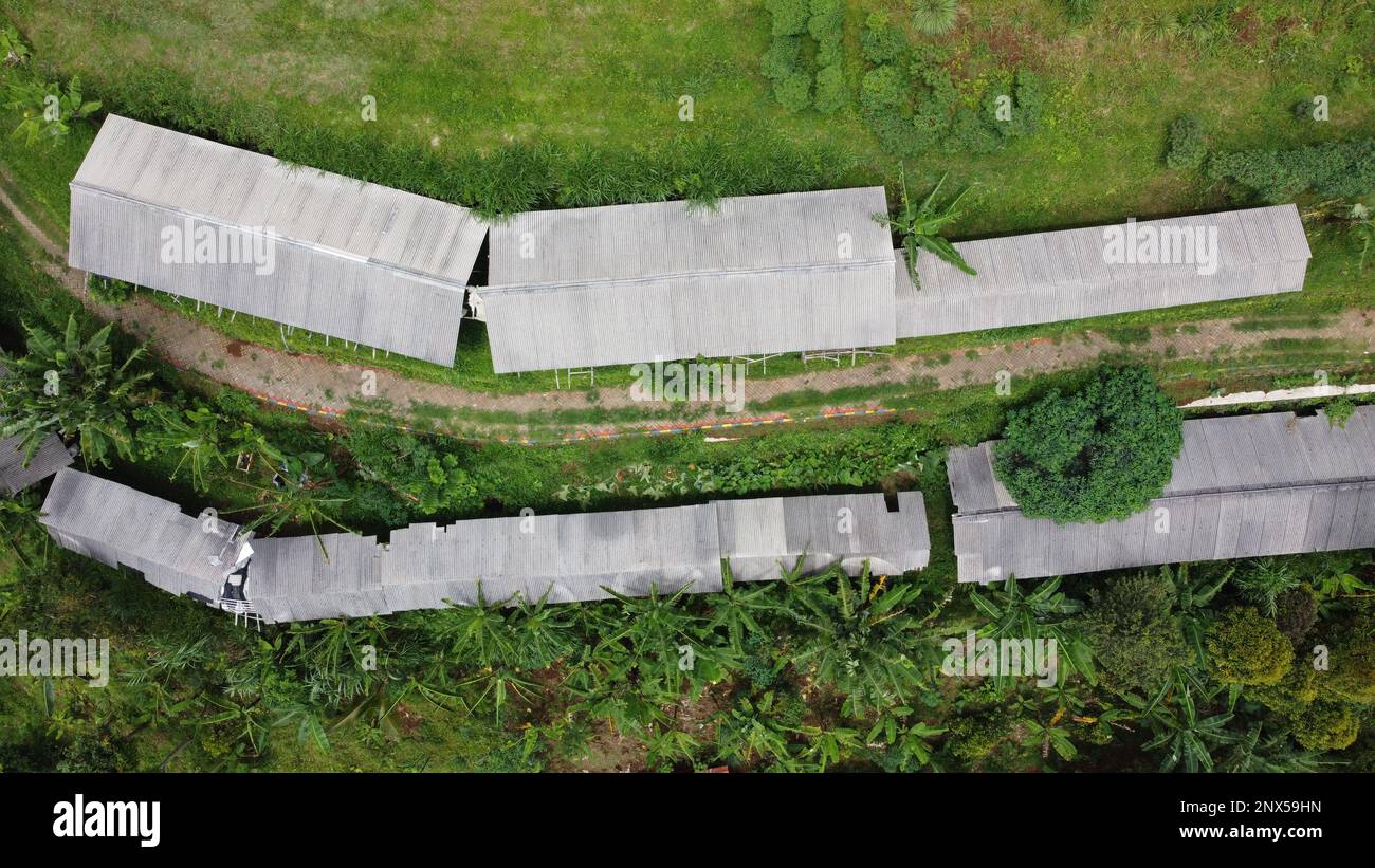 Drone photo of the view of the goat pen from above during the day. The ...