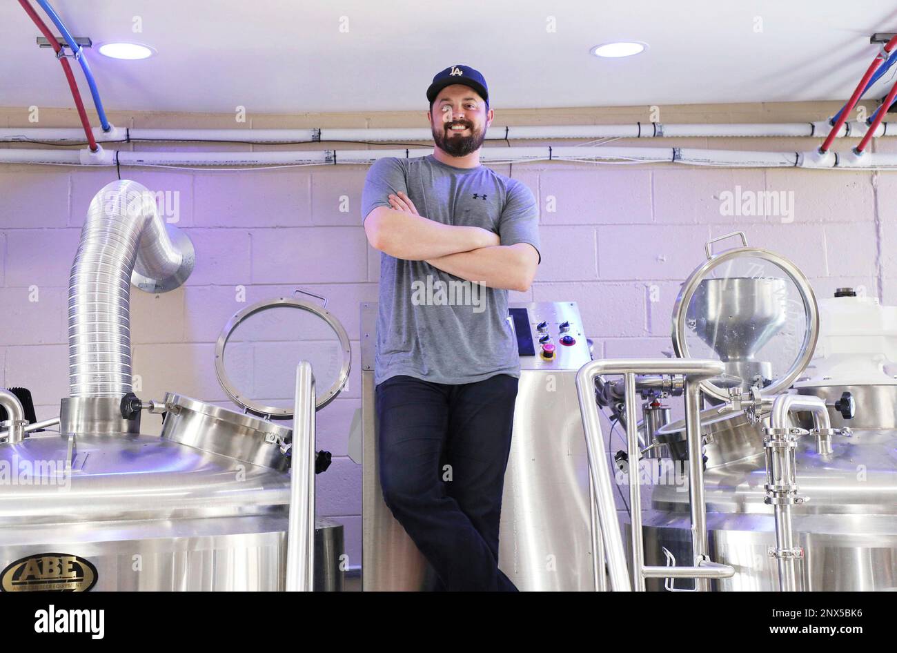 Heath Glover founder and brewmaster of Willows Family Ales stands in ...