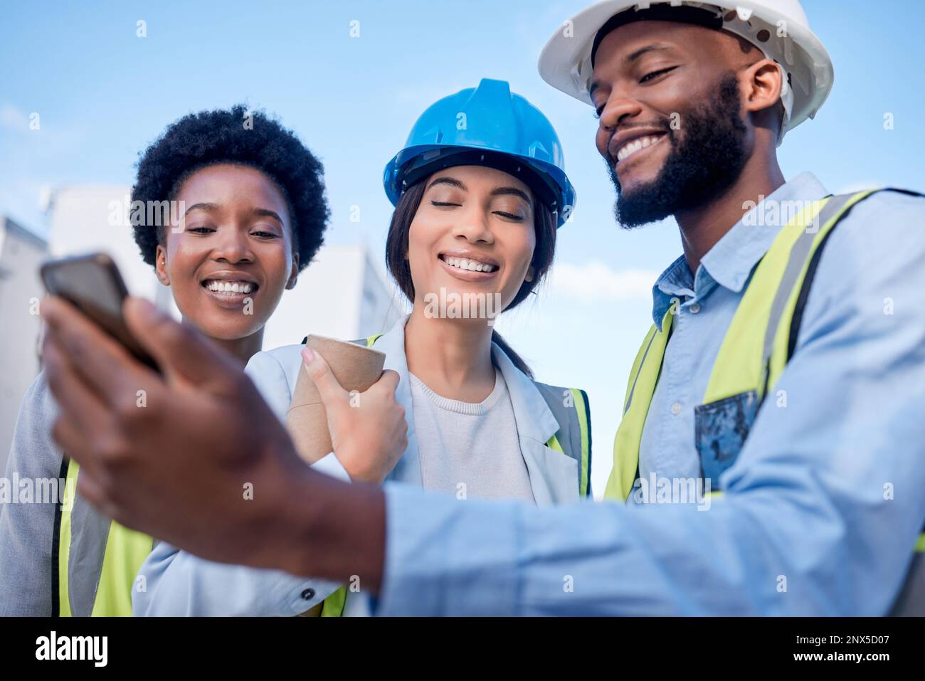 Black man, architect and phone with team in construction for project ...