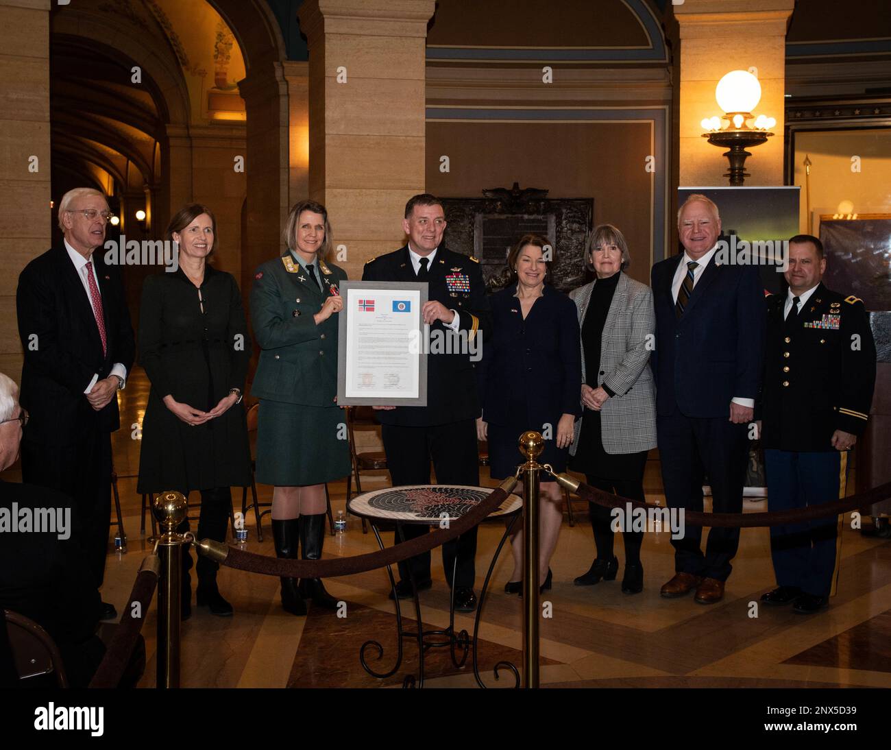 Members of the official party pose for a photo after the signing of the ...