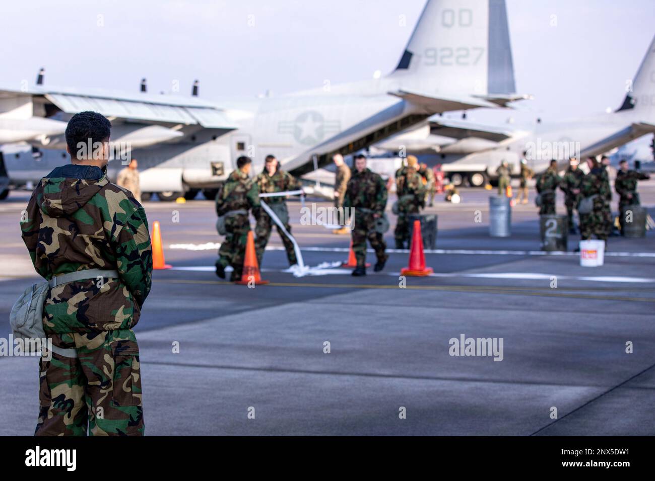 U.S. Marines with Marine Aerial Refueler Transport Squadron (VMGR) 152 set up decontamination ...