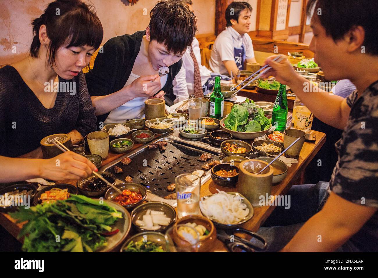 Friends eating Korean Barbeque, in Myeongdong restaurant, Myeongdong 8 ...