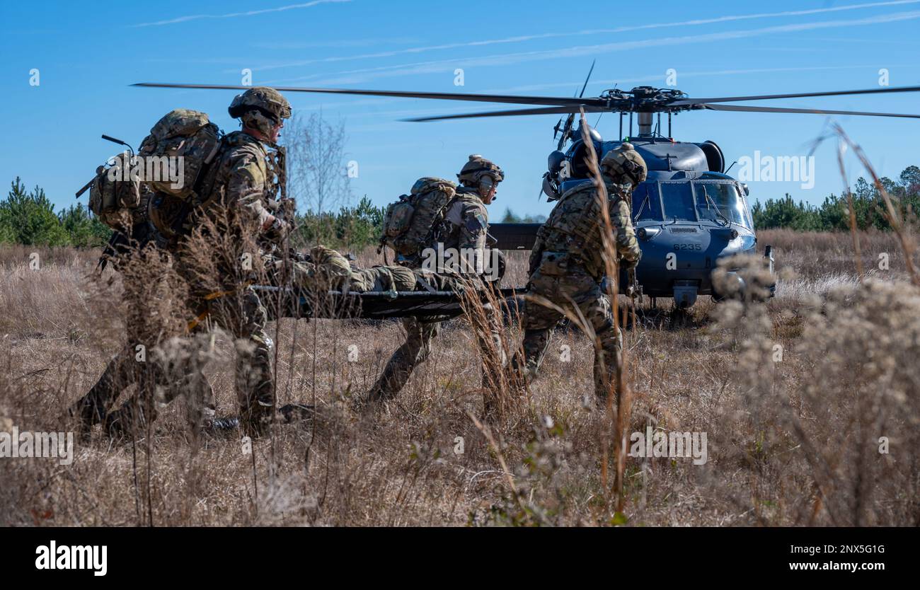 920th Rescue Wing Pararescuemen transport a simulated patient to an HH ...