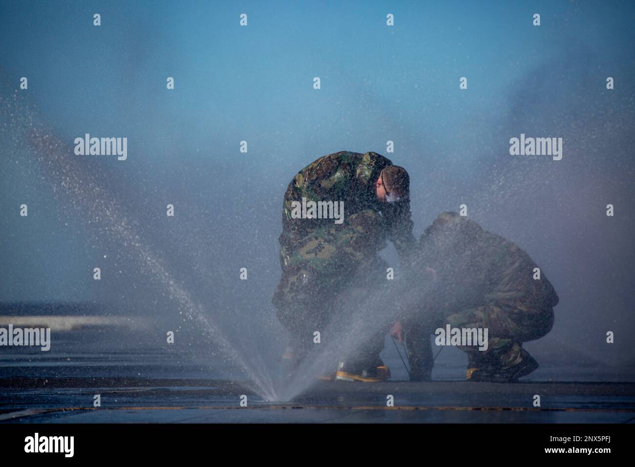 230121-N-MU675-2164 PACIFIC OCEAN (Jan. 21, 2022) Sailors check a ...