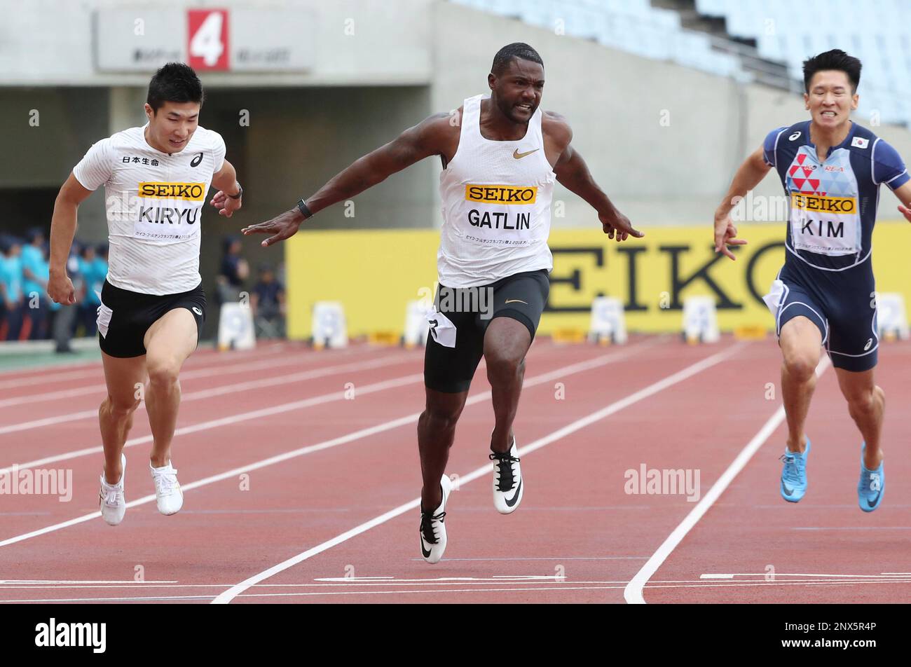 American sprinter Justin Gatlin(C) competes during men's 100 meters of ...