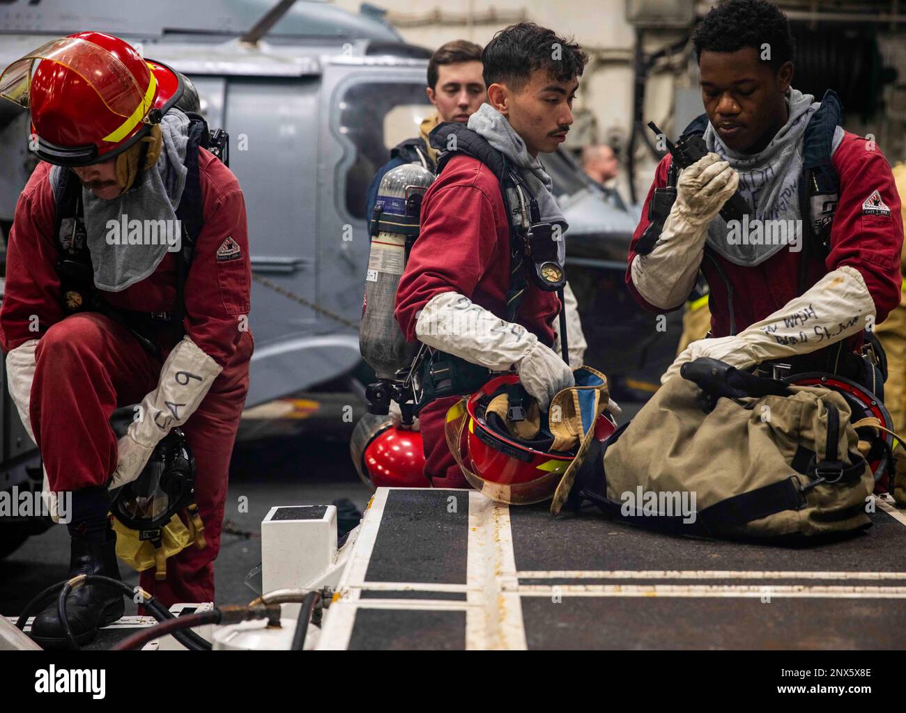 230120-N-XK047-1001 Sailors prepare for a general quarters drill aboard ...