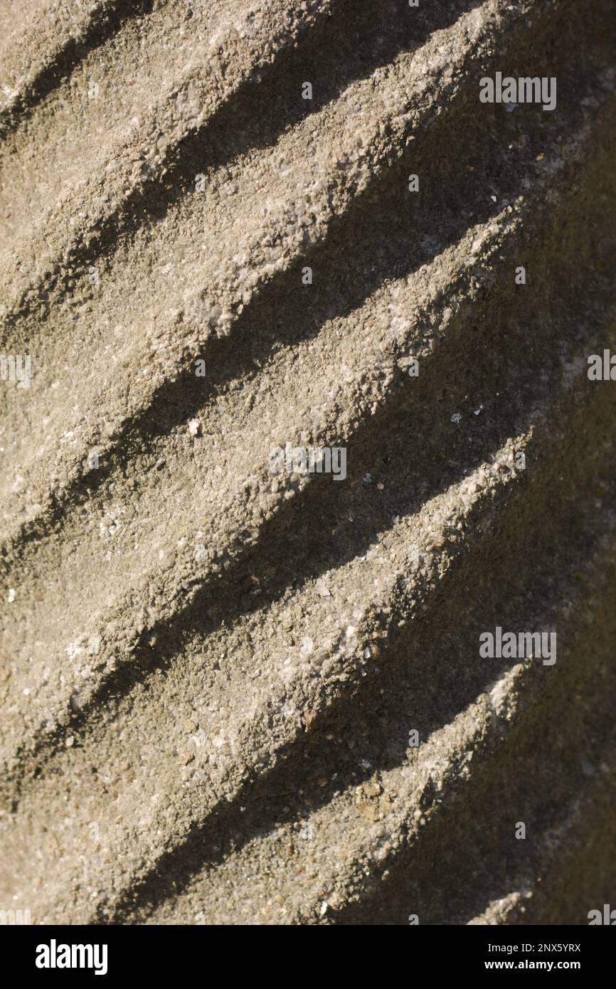 A closeup view of a fluted column carved in natural stone Stock Photo ...