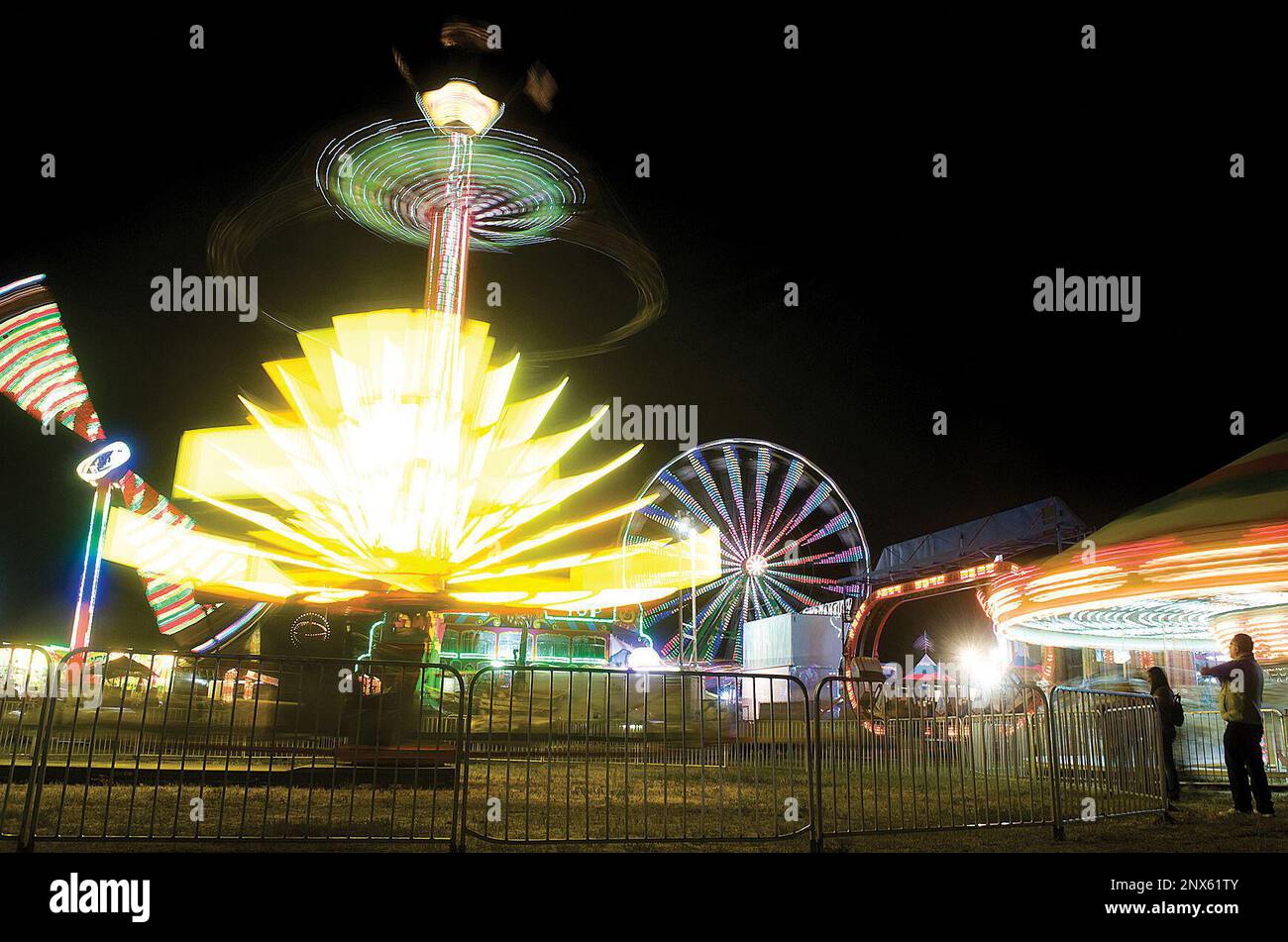 The bright night lights attract carnival lovers at the Porterville ...