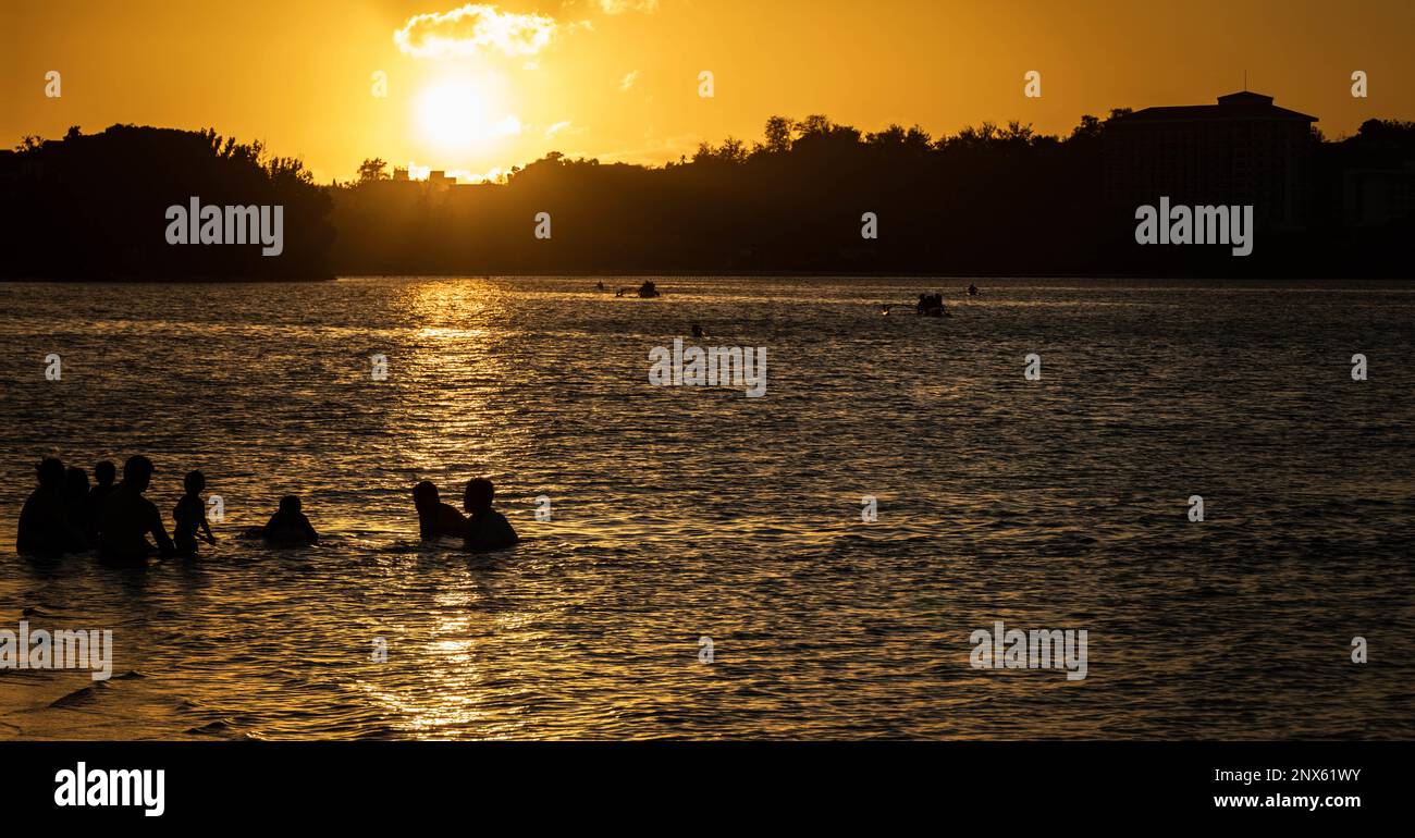 Local residents of Guam swim and view the Pacific Ocean at Matapang ...