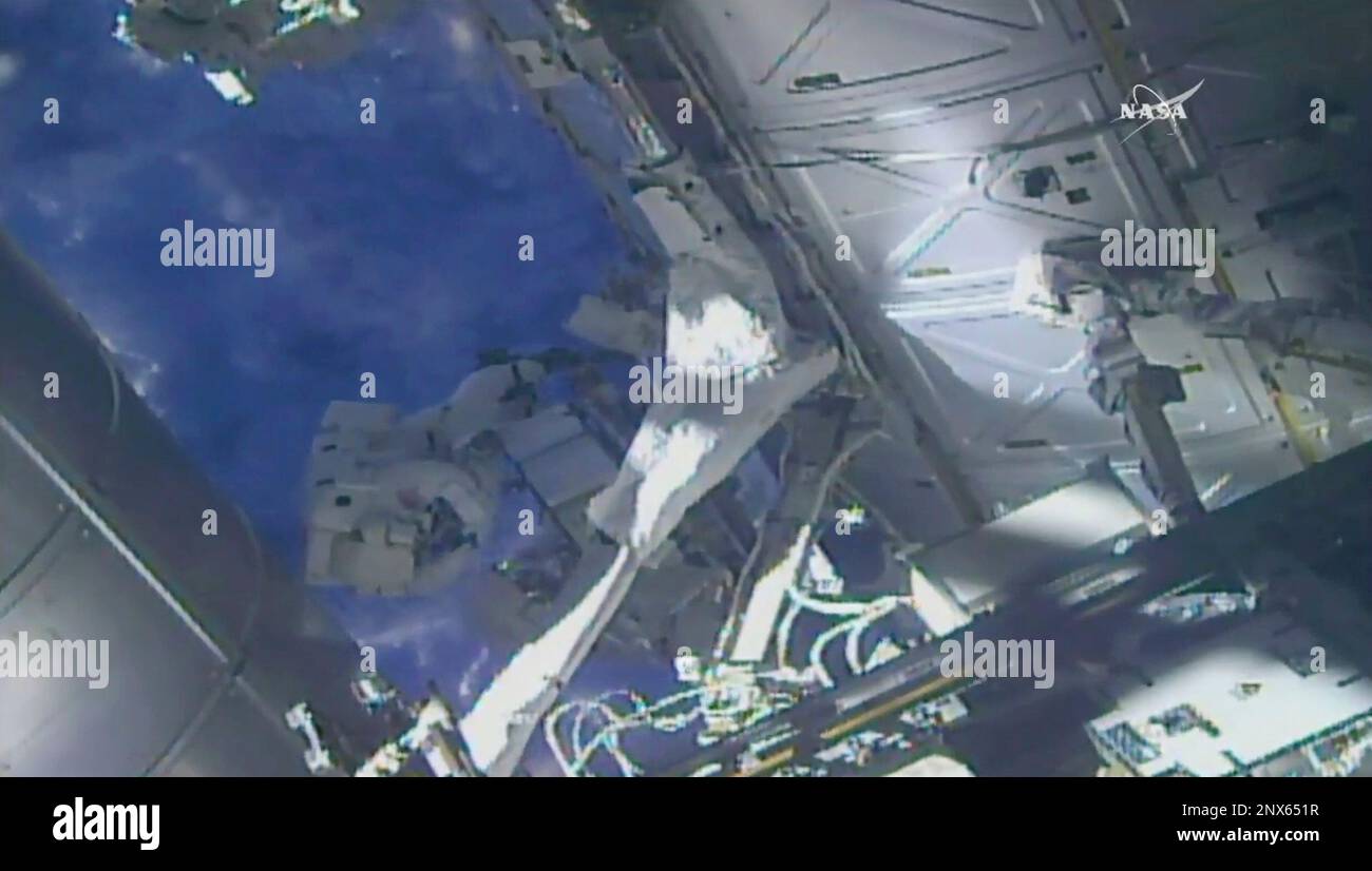 In this frame from NASA TV, NASA astronaut Ricky Arnold, left, and NASA ...