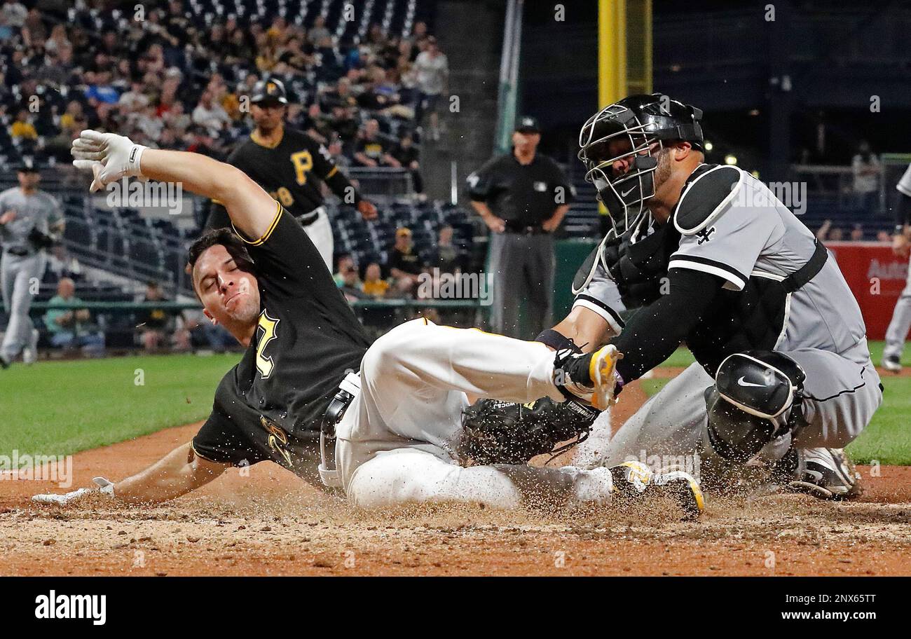 Pittsburgh Pirates' Adam Frazier, left, beats the tag by Chicago White ...