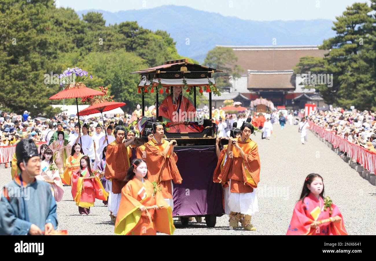 Shiho Sakashita (L) the queen "Saiodai", dressed in traditional multi ...
