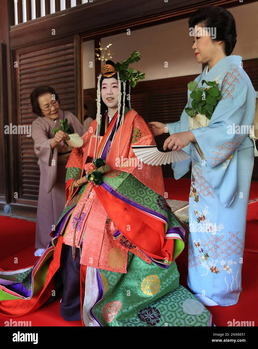 Shiho Sakashita (C) the queen "Saiodai", dressed in traditional multi ...