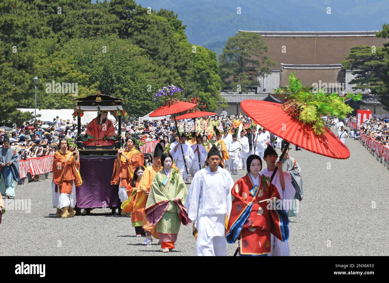 Shiho Sakashita (L) the queen "Saiodai", dressed in traditional multi ...