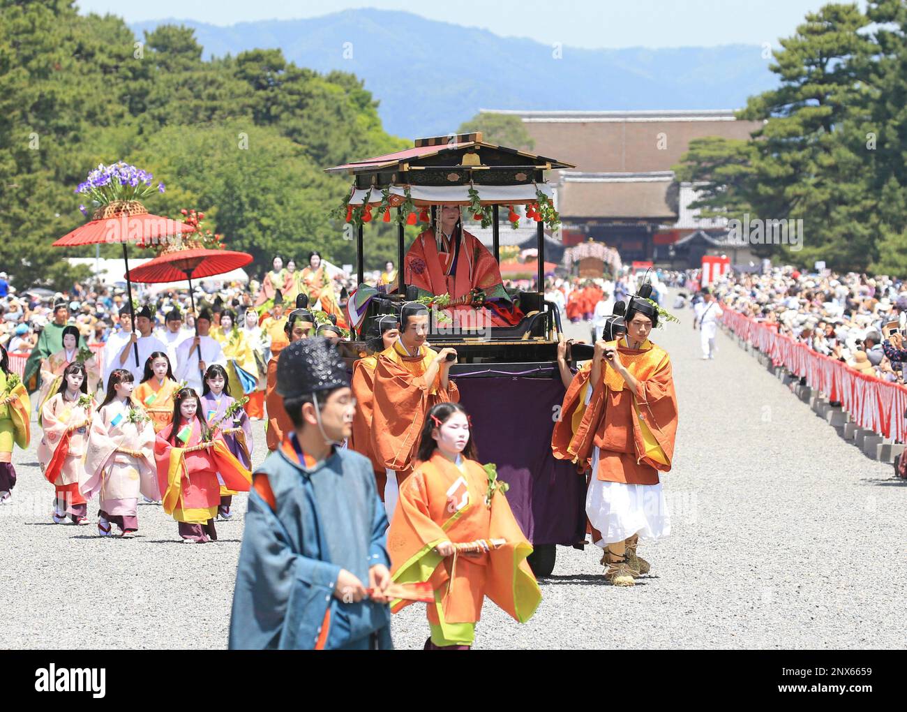 Shiho Sakashita (C) the queen "Saiodai", dressed in traditional multi ...