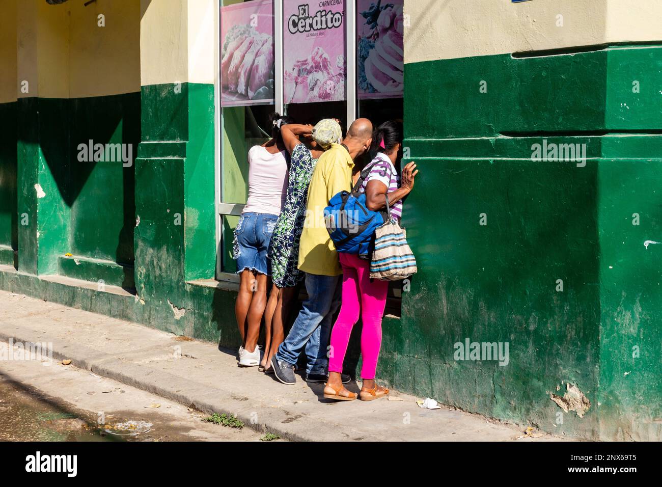 Havana, Cuba - December 14, 2022: People looking in a store window ...