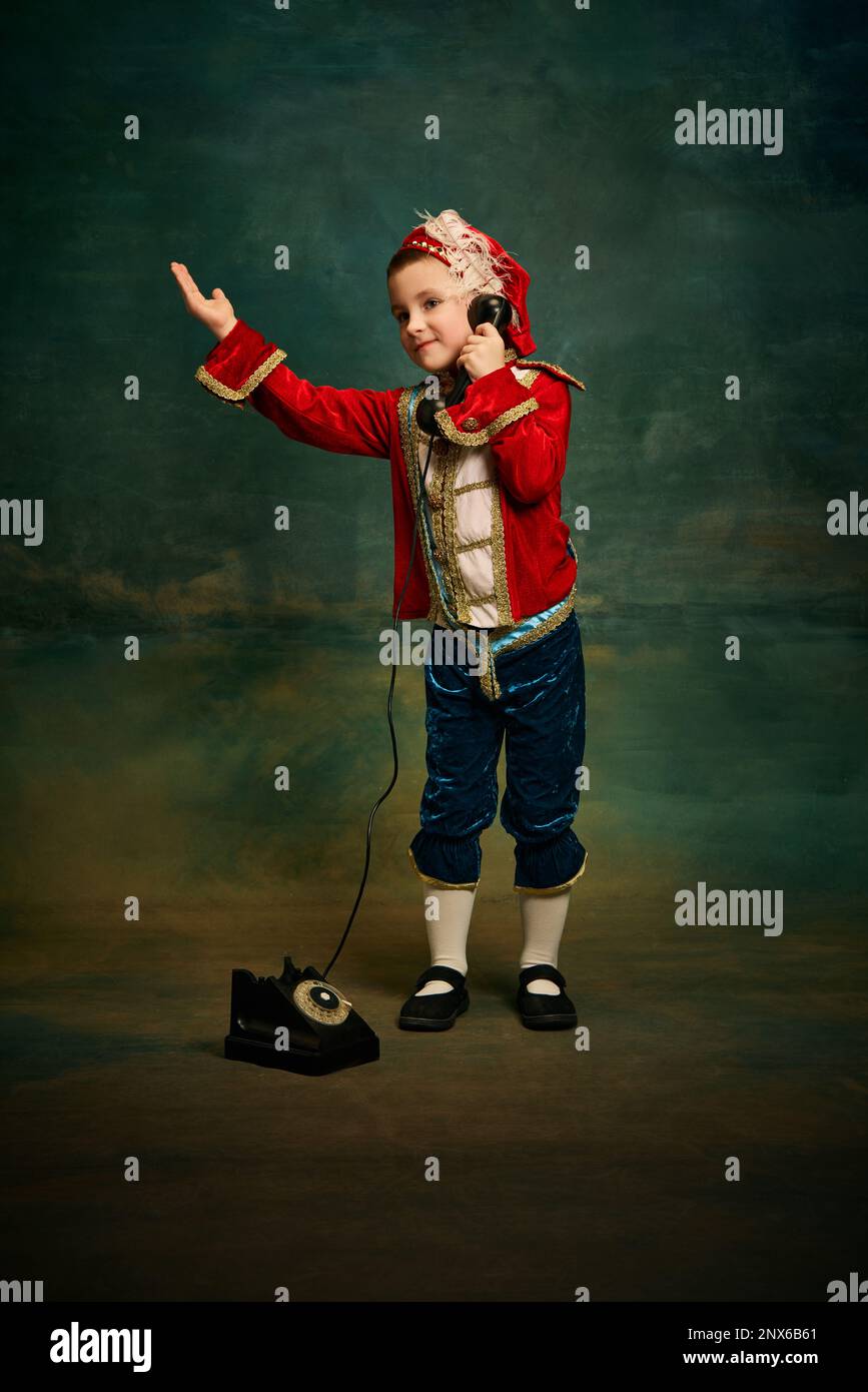 Charming little kid dressed up as medieval little prince and pageboy ...