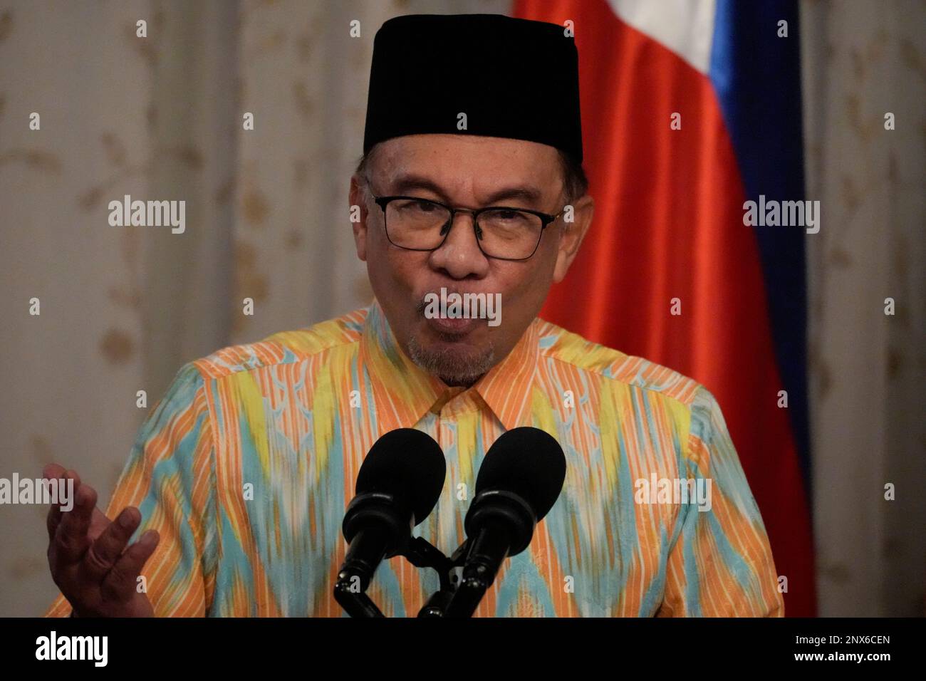 Malaysia's Prime Minister Anwar Ibrahim gestures as he delivers his speech during his visit at ...