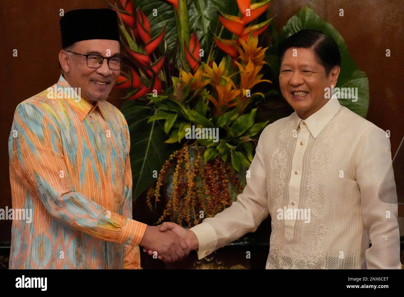 Philippine President Ferdinand Marcos Jr., right, shakes hands with ...