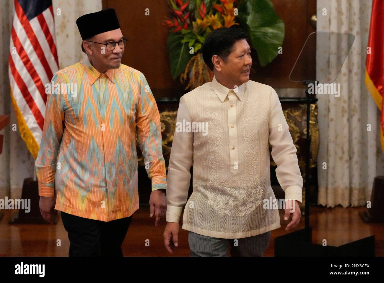 Philippine President Ferdinand Marcos Jr., right, walks with Malaysia's ...