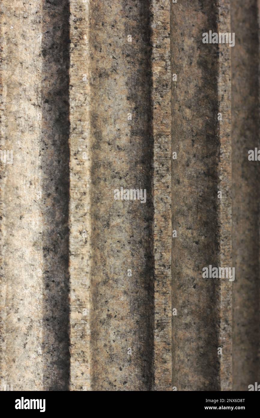 A closeup view of a fluted column carved in natural stone Stock Photo ...