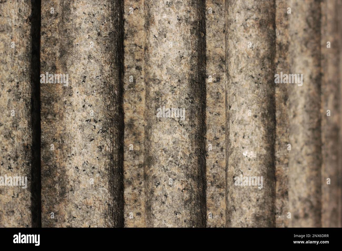 A closeup view of a fluted column carved in natural stone Stock Photo ...