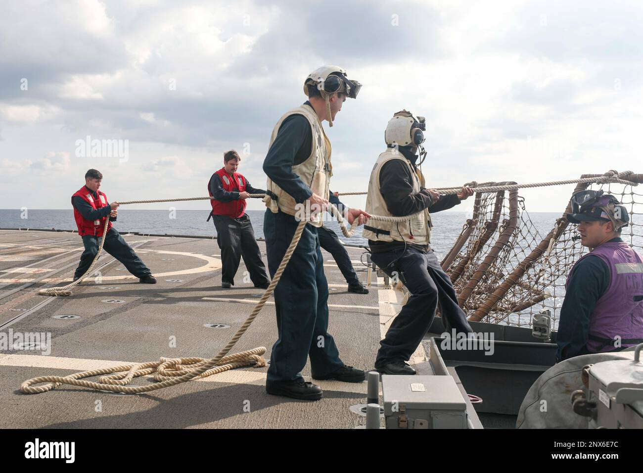 230119-N-BN445-1322 PHILIPPINE SEA (Jan. 19, 2023) Sailors lower the ...