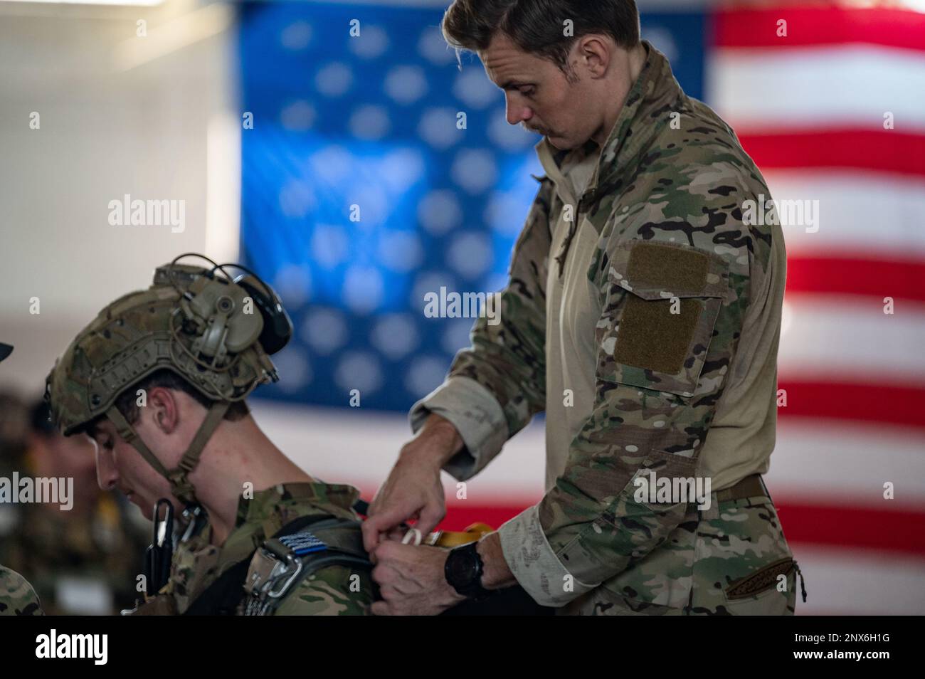 A Special Tactics operator conducts a Jumpmaster Personnel Inspection ...