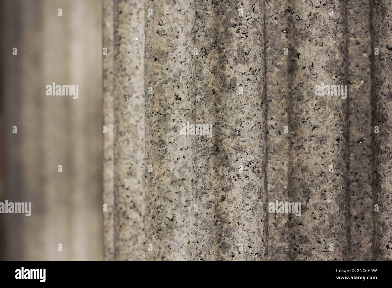 A closeup view of a fluted column carved in natural stone Stock Photo ...