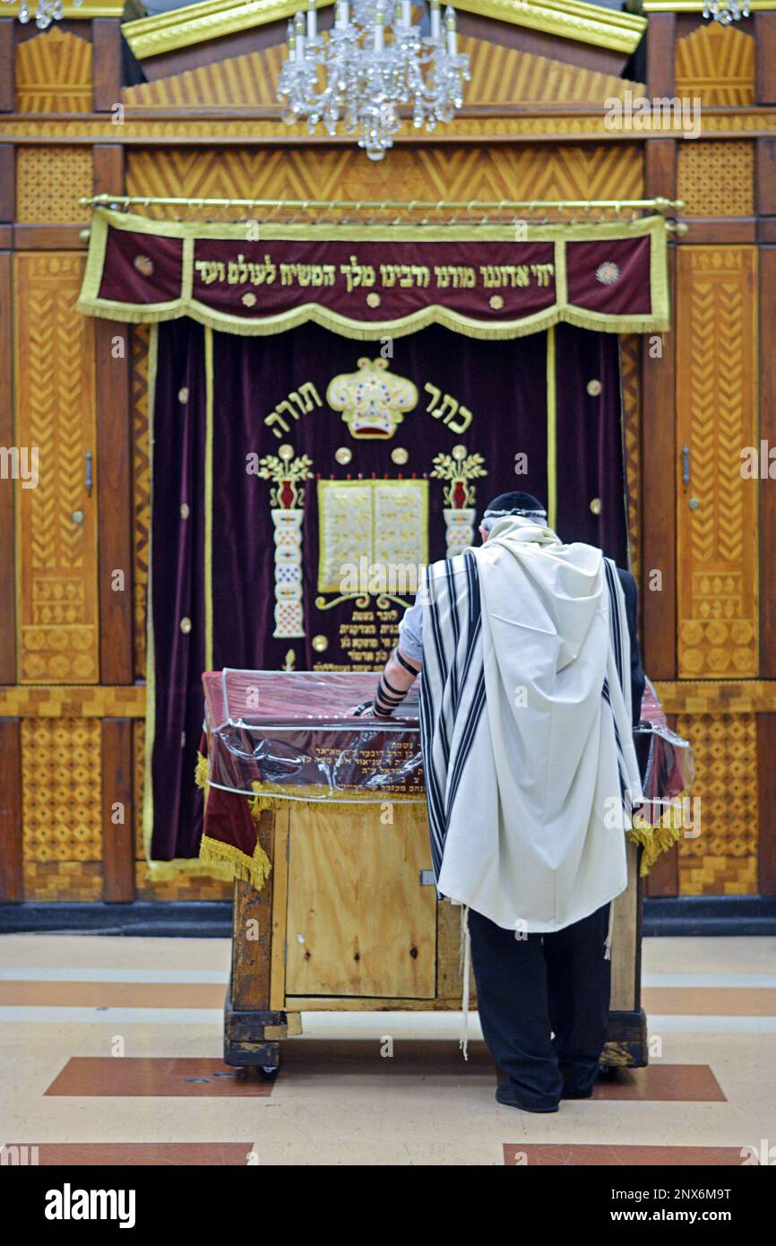 A generic anonymous photo of a religious Jewish man praying near the ...