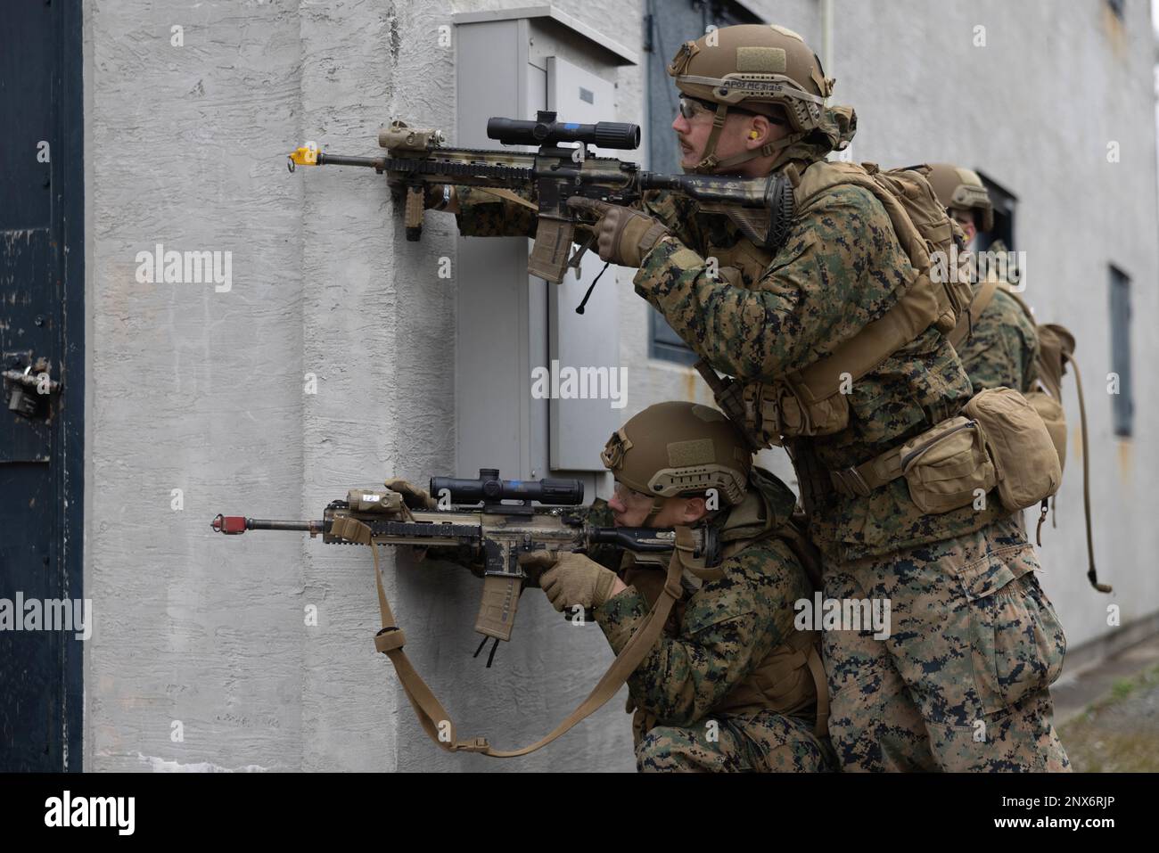 U.S. Marines with 1st Battalion, 7th Marines, 3d Marine Division conduct a raid during a squad ...