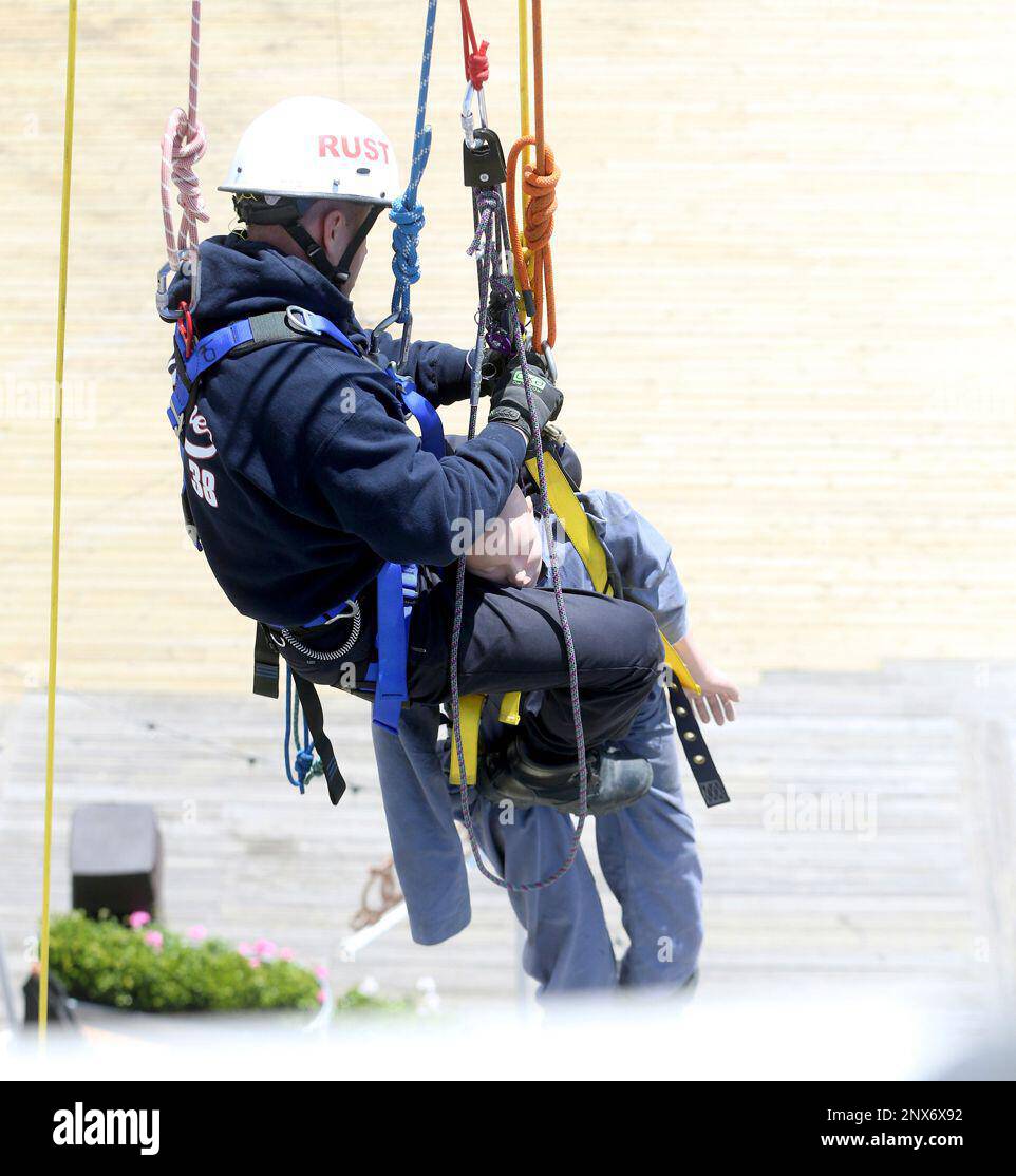 Wildwood fire fighter Ryan Troiano is lowered from the Sea Serpent ...