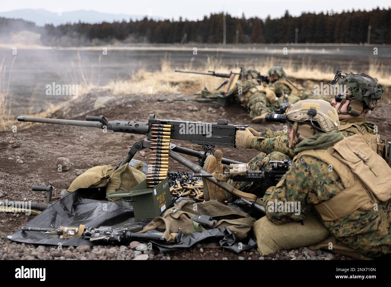 U.S. Marines with 3d Battalion, 4th Marines fire an M2A1 machine gun ...