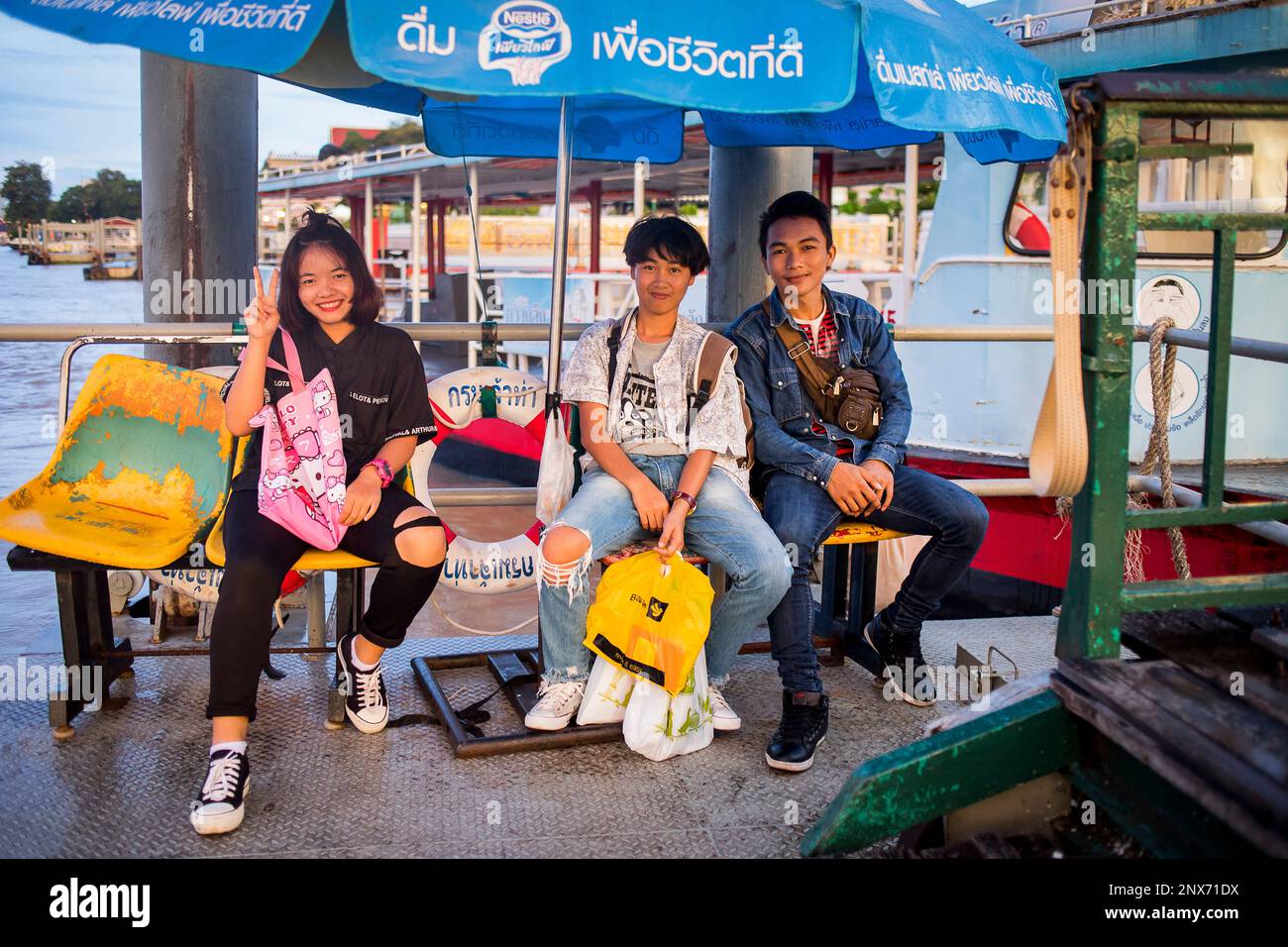 Friends waiting for express boat ferry in Khun Mae Pueak Cross River ...