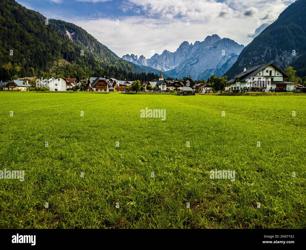 The mountain town of Valbruna and the Julian Alps. Dream nature. Friuli ...
