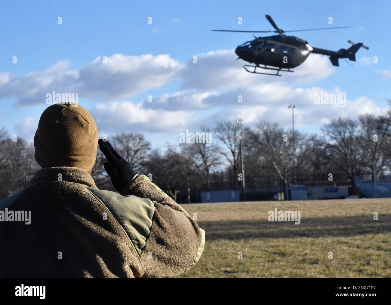 COL Brian Jacobs, USAG Fort Hamilton Commander, salutes the helicopter ...